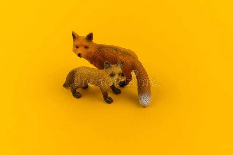 Toy Fox from Plastic on a Yellow Background Stock Image - Image of ...