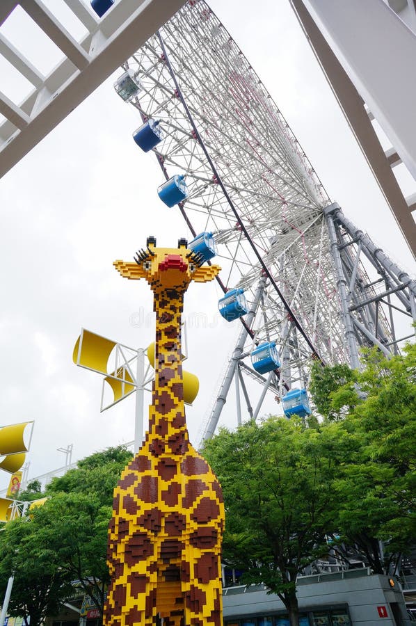 Toy Giraffe Under Ferris Wheel Editorial Image - Image of animal ...