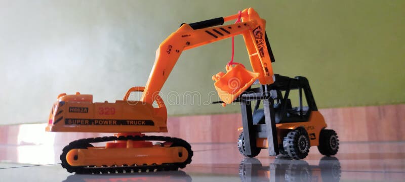 Toy Heavy Equipment Excavators and Forklifts Stock Photo - Image of ...