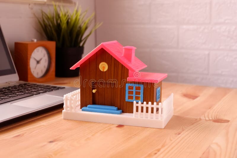 Toy House on Desk with Laptop Computer, the Concept of Buying a Dream ...