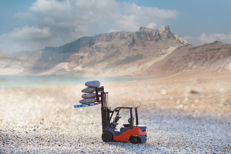 Toy Loader Loads Stones on a Sandy Landscape. Loading and Construction ...