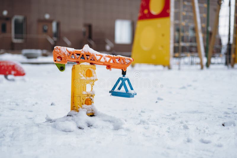Toy Loading Crane on Playground in Snow in Winter Stock Image - Image ...