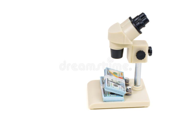 Toy Microscope Examining Stacked Banknotes for Fraud Detection Stock ...