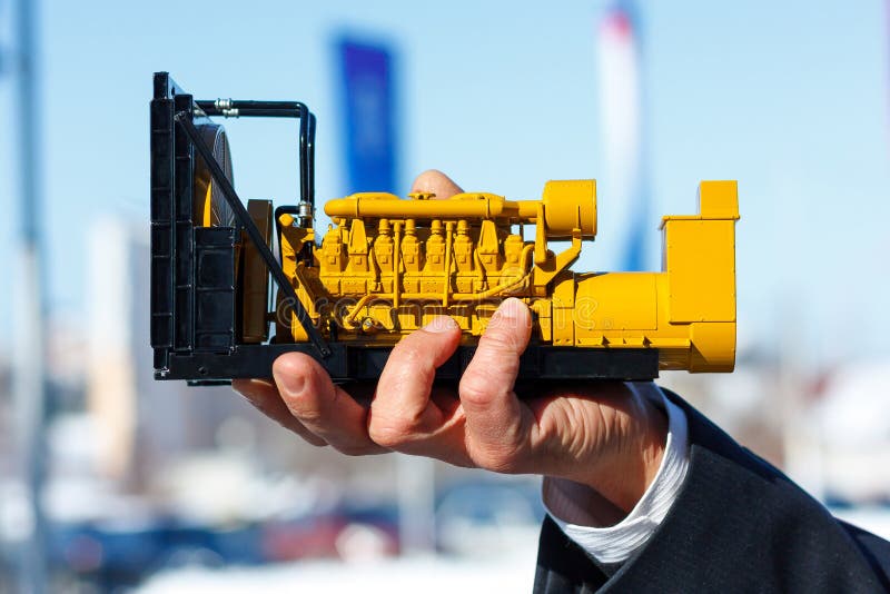 A Toy Model of a Gas Generator Set is in the Male Hand. Stock Image ...