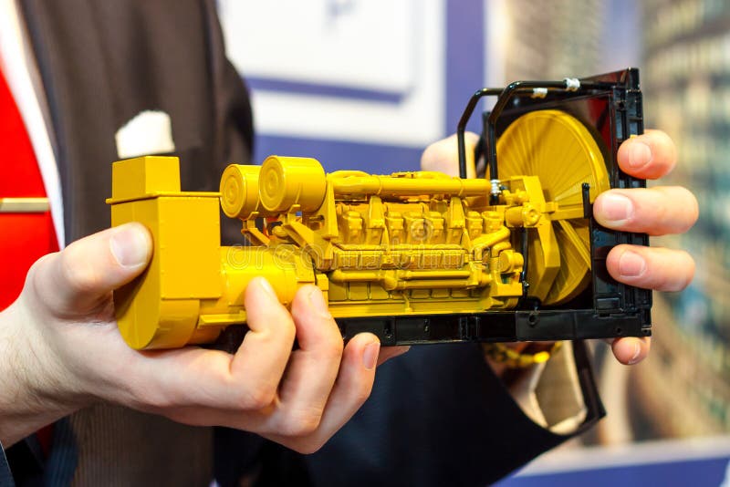 A Toy Model of a Gas Generator Set is in the Male Hand. Stock Photo ...