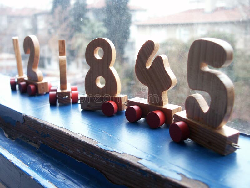 Toy numbers by the window stock image. Image of children - 7786939