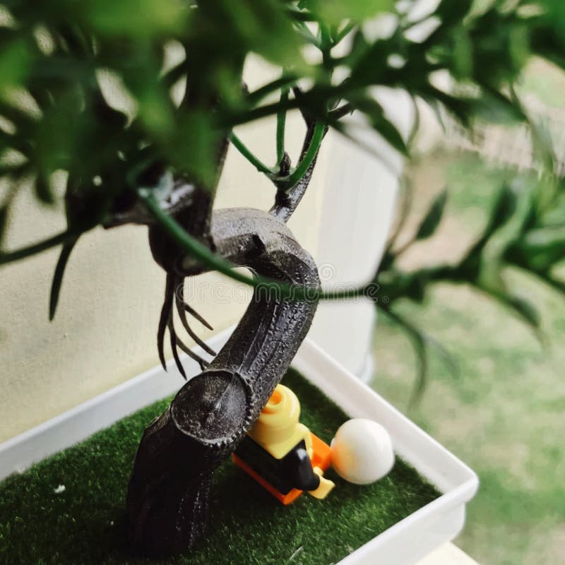 Toy Objects Leaning Against a Tree Stock Photo - Image of outdoor ...