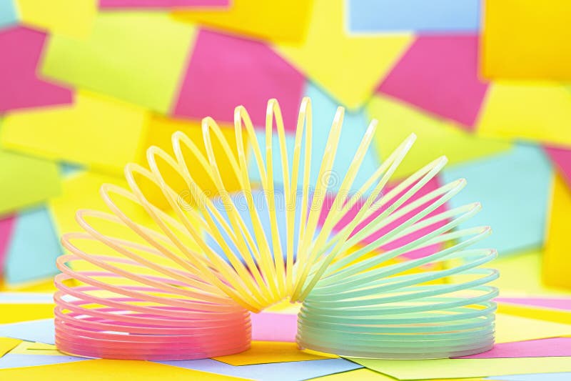 Toy Plastic Rainbow on a Multicolored Paper Sticky Notes on Background ...
