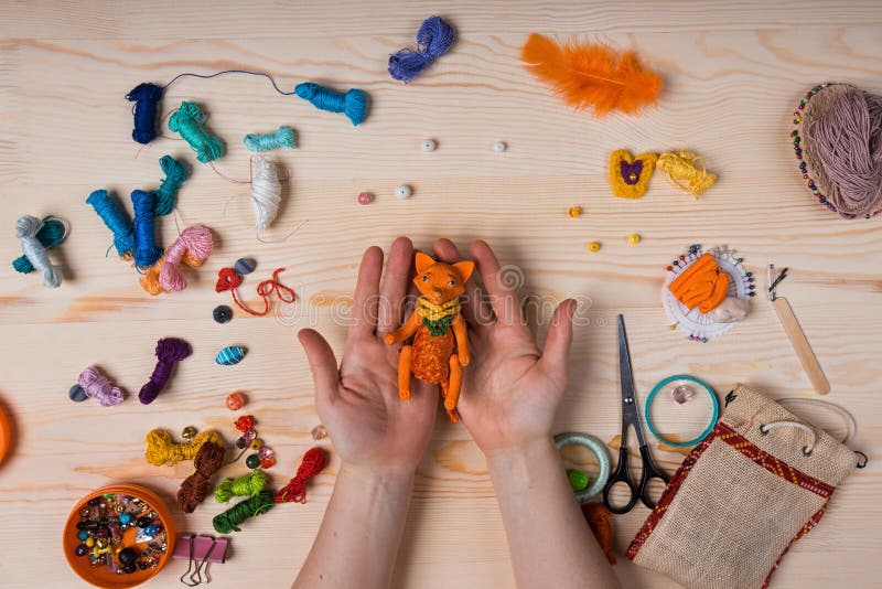 Toy Red Fox Made His Hands on the Wooden Background. Stock Photo ...