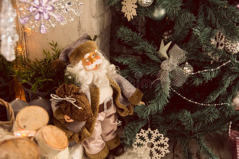 Toy Santa with a Bag Near the Christmas Tree Stock Image - Image of ...