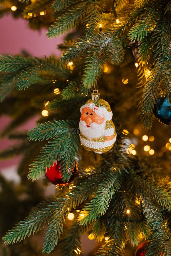 Toy Santa Claus or Santa Claus on the Christmas Tree with Lights Stock ...