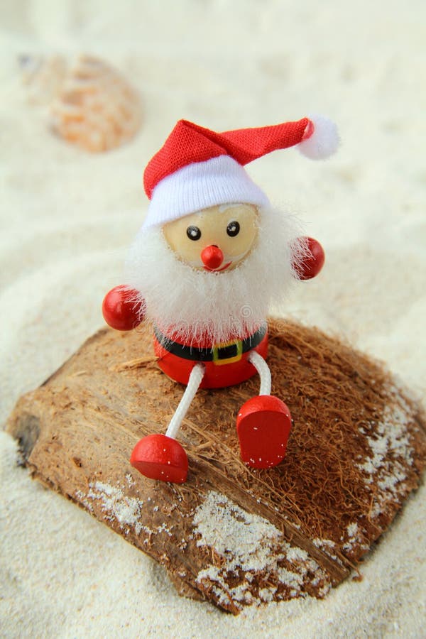 Toy Santa Claus on Sand Beach Stock Image - Image of gift, beard: 17306099