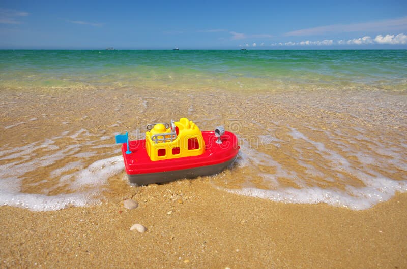 Toy ship on the sea shore. stock photo. Image of hobbies - 82103596