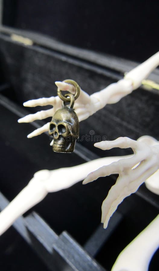 Toy Skeleton Hand Holding a Skull Stock Image - Image of decoration ...