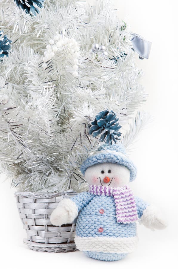 Toy Snowman Next To a White Christmas Tree Stock Photo - Image of ...