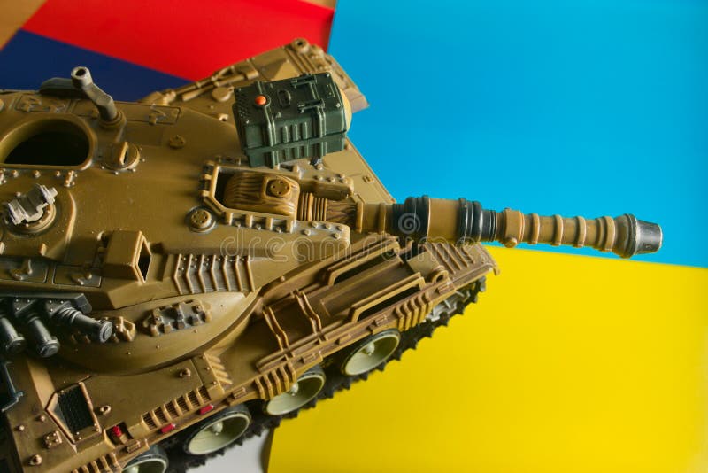 A Toy Tank Over the Ukrainian and Russian Flags Stock Image - Image of ...
