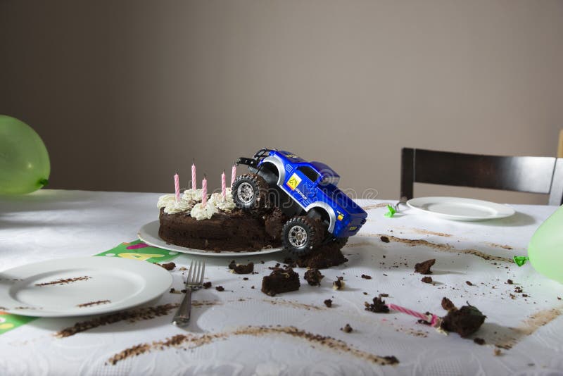 Toy Tar Driven into Birthday Cake Stock Photo - Image of tragedy, view ...