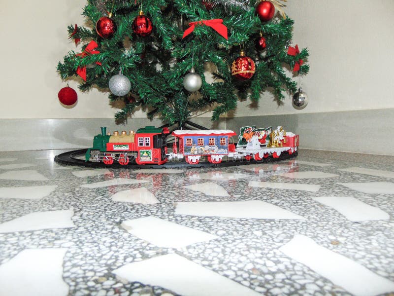 Toy Train Placed Under a Christmas Tree Stock Image - Image of tree ...