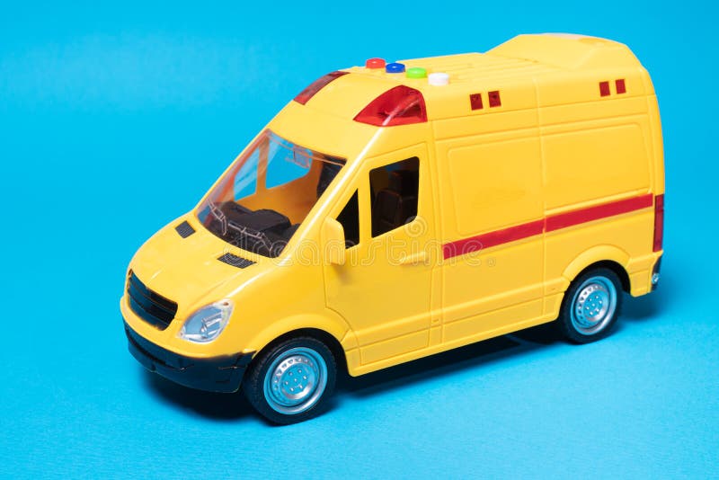 The Toy Van is Yellow with Flashing Lights on a Blue Background Stock ...
