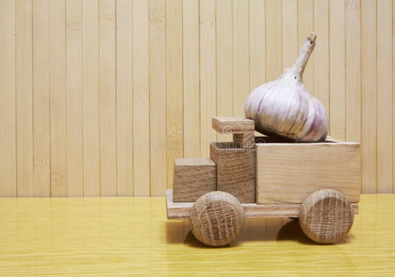 Toy wooden car with garlic stock photo. Image of healthy - 79160666