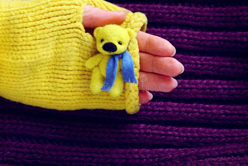 Toy yellow bear in hand stock image. Image of smol, cute - 46885325