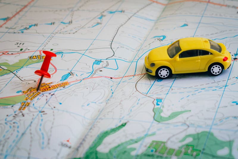 Toy Yellow Car Rides on the Route Marked on a Topographic Map Stock ...