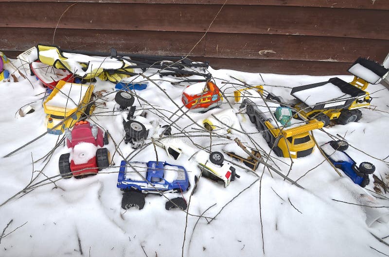 Toys Left Behind on a Snowy Ground Stock Image - Image of kids, ground ...