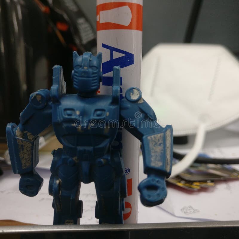 A Robot with a Blue Eye Pointing To the Right by AI Generated Image ...