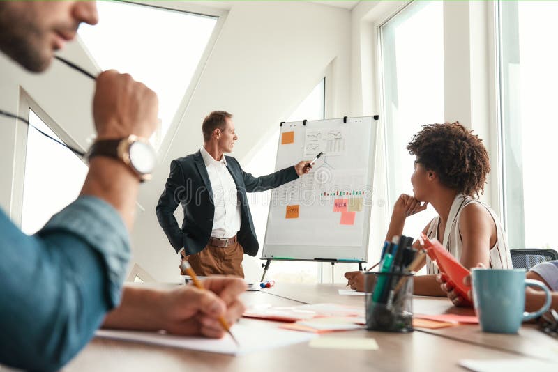 Discussing New Project. Mature Businessman Standing Near Whiteboard and ...