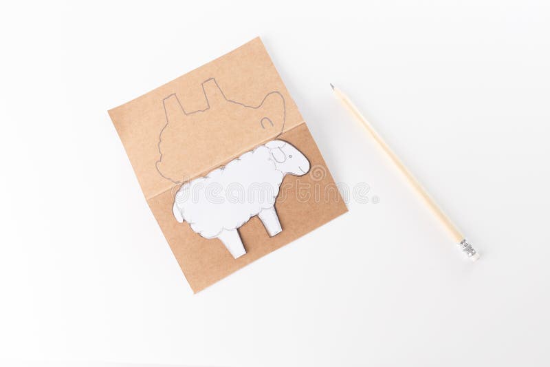 Trace the Outline of a Sheep Onto a Piece of Cardboard Using a Pencil ...