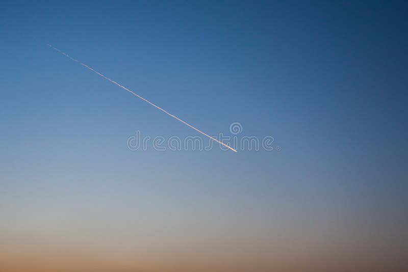 The Trace of the Plane in the Sky, in the Clear Evening Sky Stock Image ...