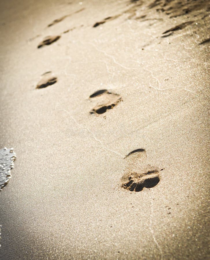 Traces on the Beach of a Man and a Woman. Stock Photo - Image of ...