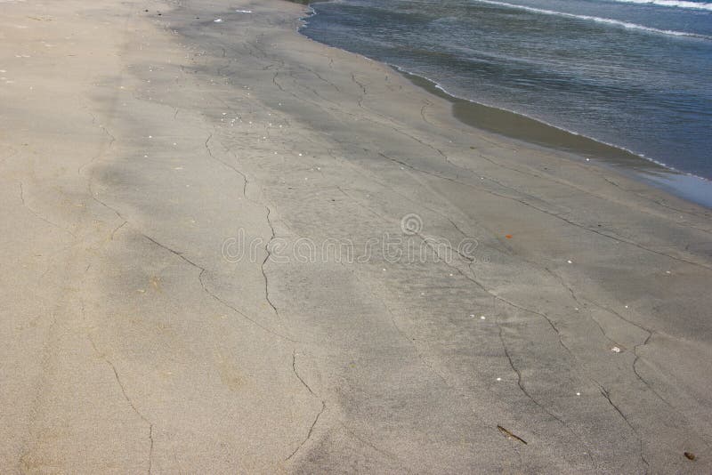 Traces of oil on the coast stock image. Image of texture - 63732047