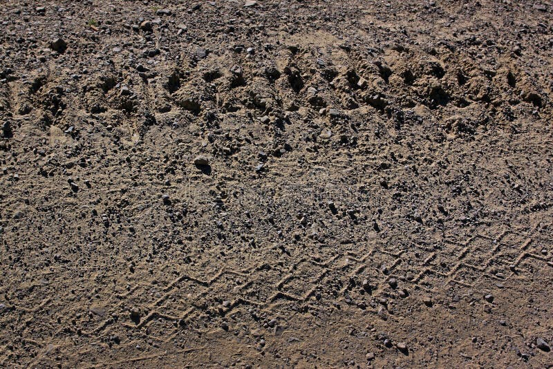 The Track from the Caterpillar Tractor on a Dirt Road. Stock Image ...