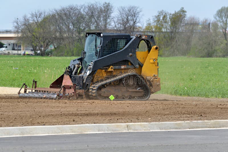 Track Skid Steer Multi Terrain Loader Landscaping an Area Stock Image ...