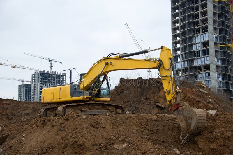 Track-type Excavator during Earthmoving at Construction Site. Backhoe ...