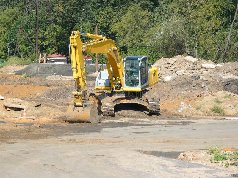 Track-type Excavator during Earthmoving at Construction Site. Backhoe ...