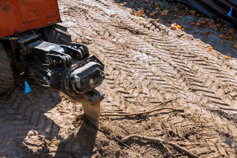 Tracked Digs the Ground for Irrigation System of Underground Pipes ...