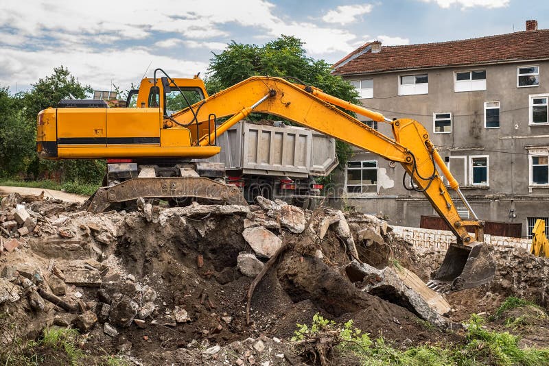 Tracked Excavator Loading the Material in a Truck Stock Image - Image ...