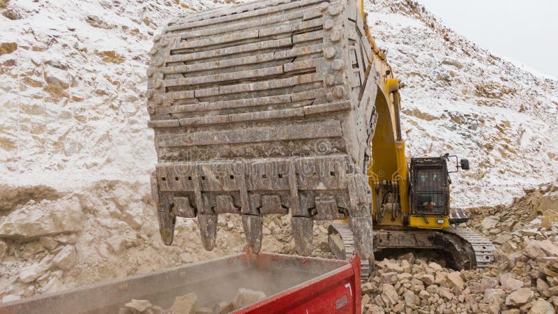 Tracked Excavator Loading the Material in a Truck Stock Image - Image ...