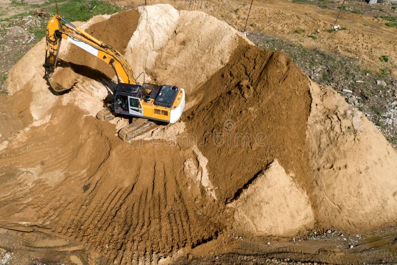 Tracked Excavator Overloads the Sand from the Embankment Stock Image ...
