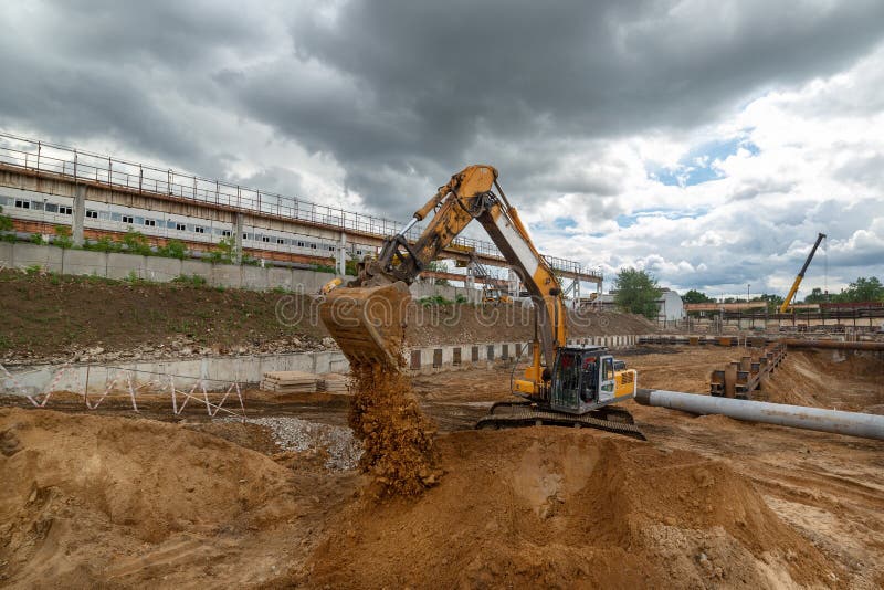 Tracked Excavator Overloads the Sand from the Embankment Stock Image ...