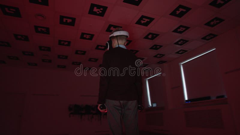 Tracking Arc Shot of a Little Boy in Virtual Reality Headset Looking ...