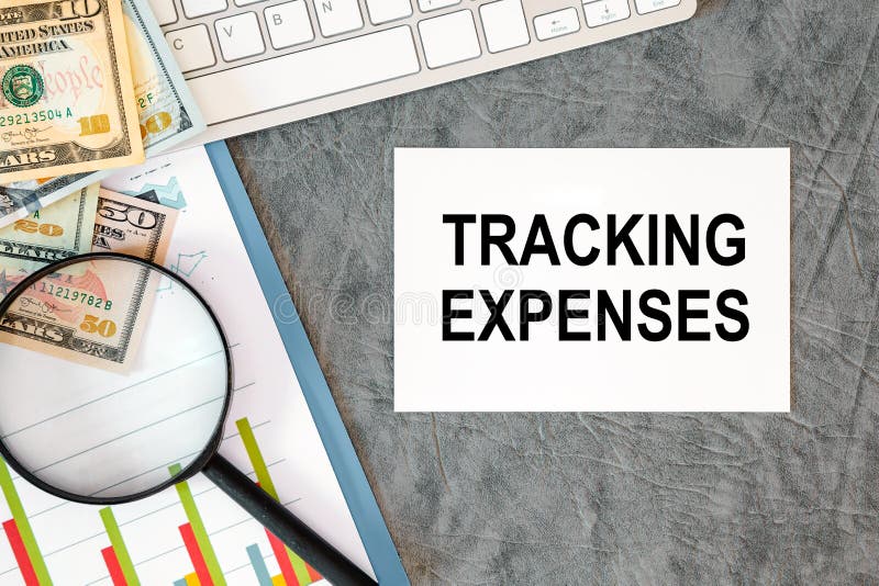 Tracking Expenses is Written in a Document on the Office Desk, Money ...