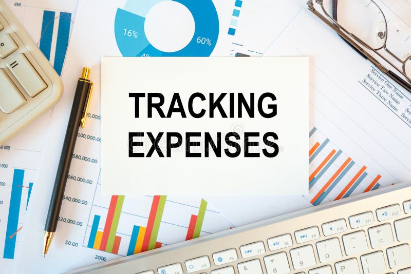 Tracking Expenses is Written in a Document on the Office Desk, Keyboard ...