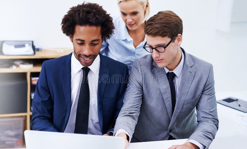 Tracking the Financial Development. Three Colleagues Looking at a Laptop Together. Stock Photo ...