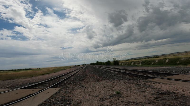 Tracking Shot Over Empty Railroads and Open Fields Under the Cloudy Sky ...