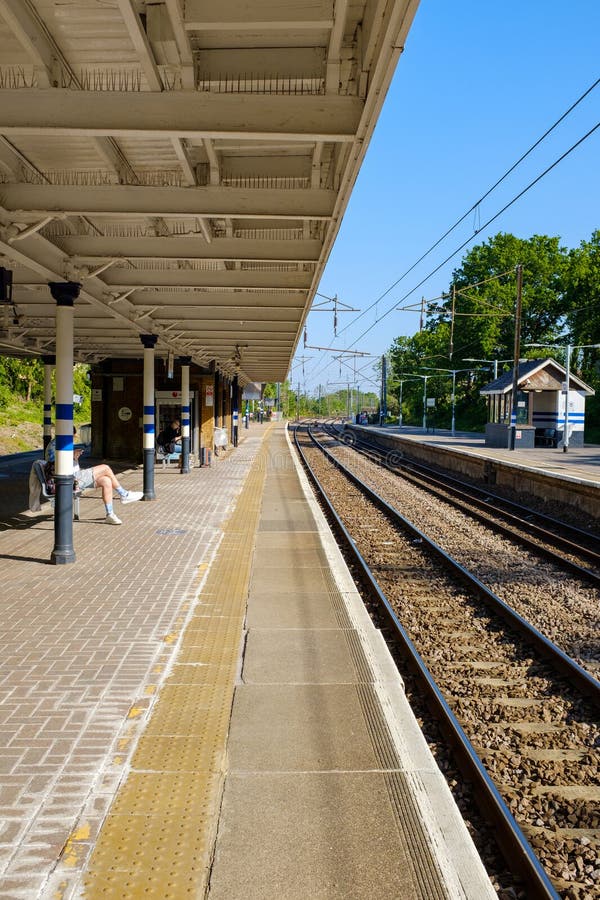 Train Station with a Sheltered Platform, Featuring White-painted ...