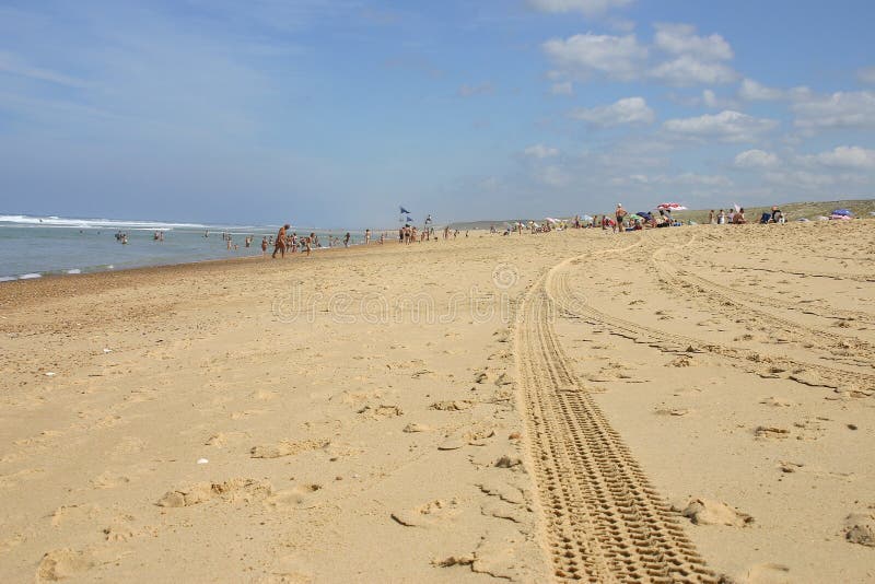 Tracks in sand stock photo. Image of flag, coastline, oceanic - 1085246