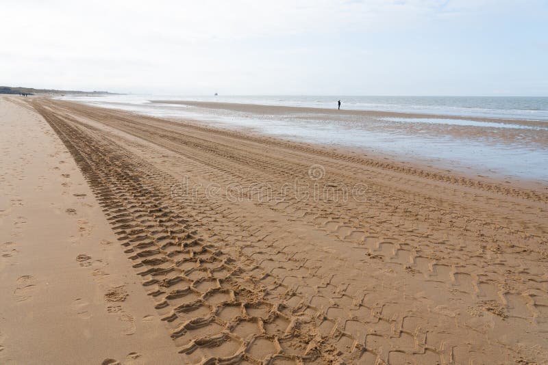 Tracks in the sand stock image. Image of transportation - 270500283
